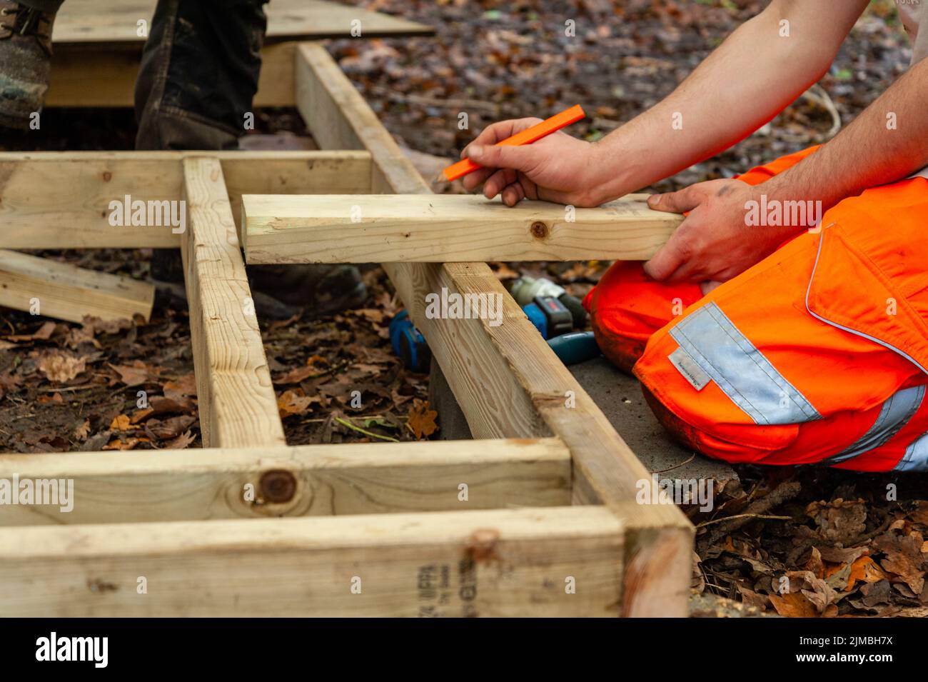 A close-up shot of building foundations carpenter working on a project ...