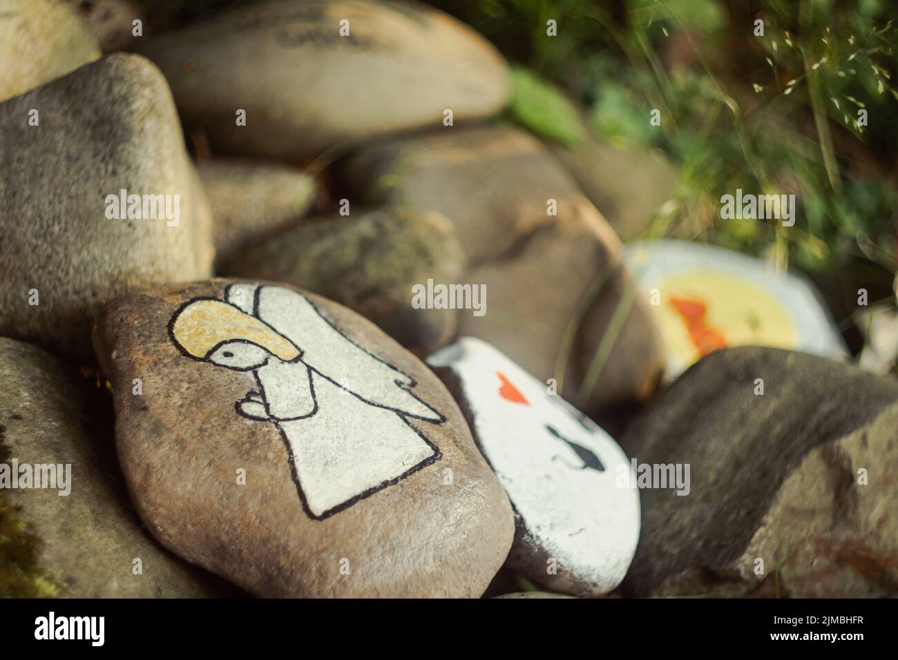 An angel drawing on a stone on the ground Stock Photo - Alamy