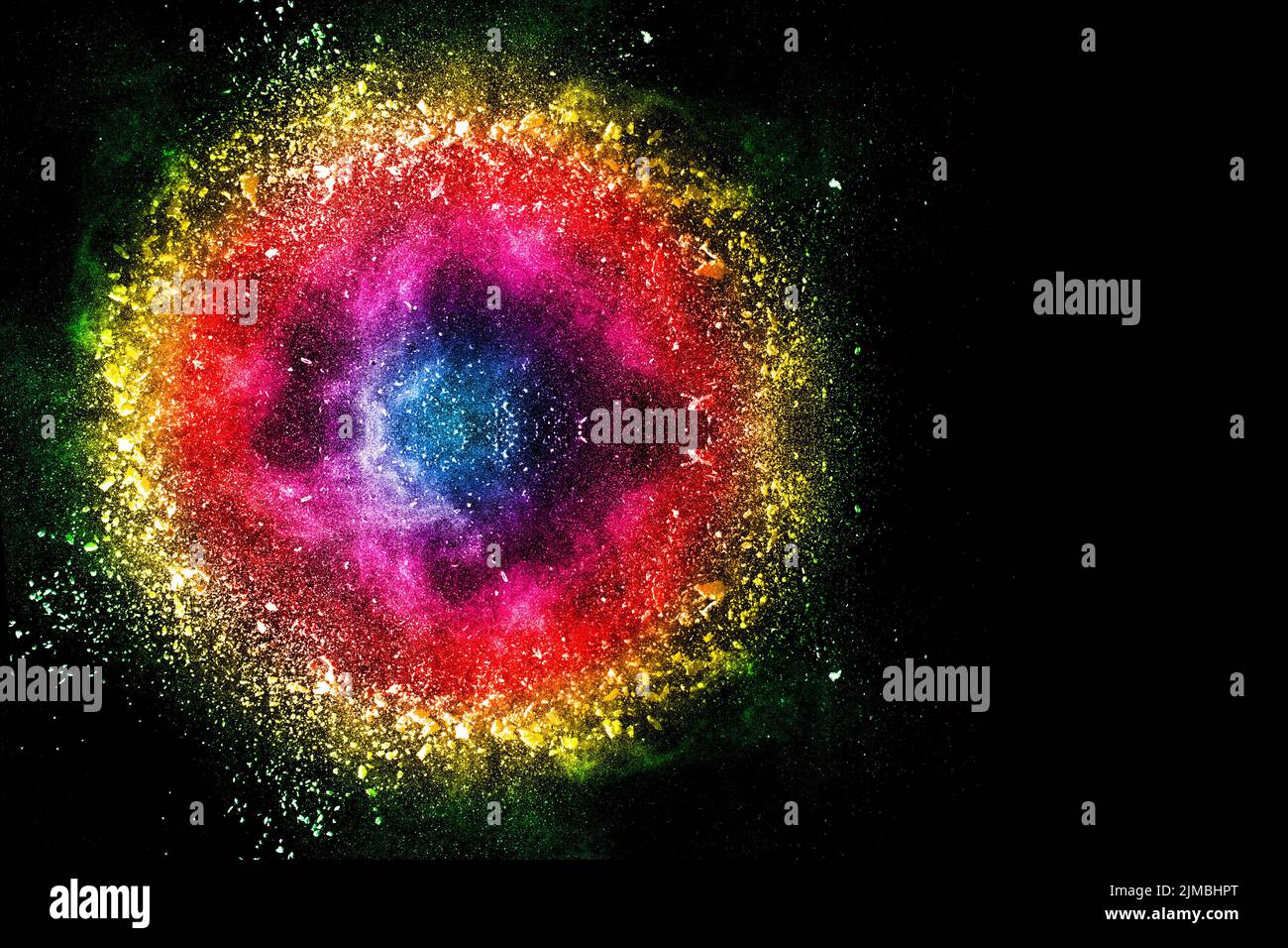 Color powder explosion cloud on black background. Freeze motion of ...