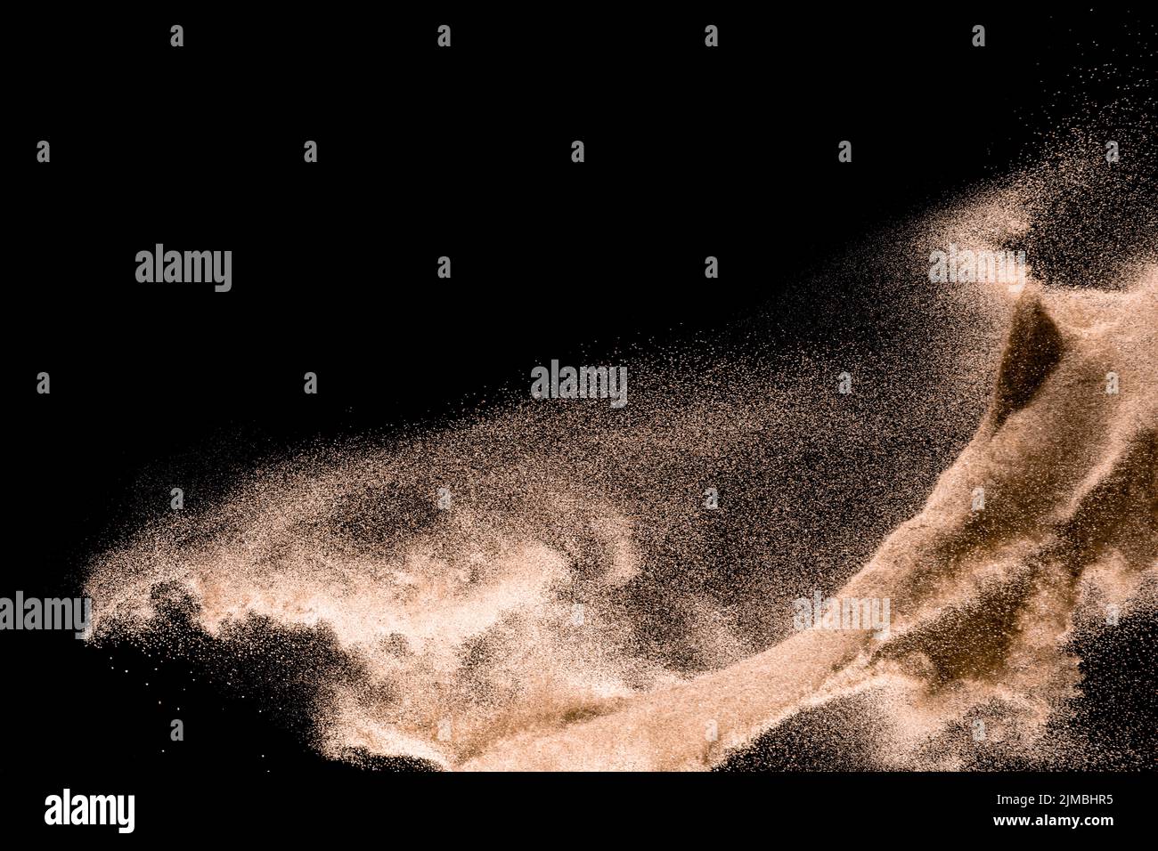 Dry river sand explosion. Golden colored sand splash against dark ...