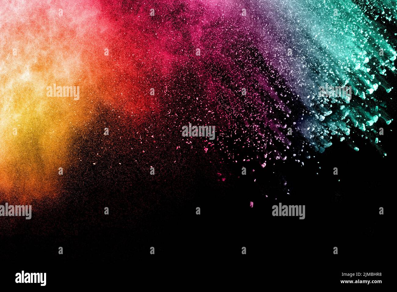 Abstract multicolored powder explosion on black background.Freeze ...