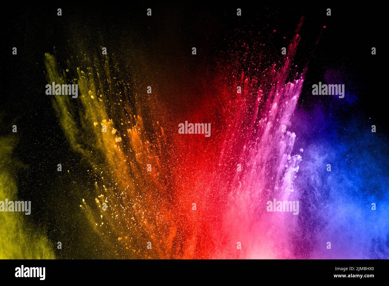Abstract color powder explosion on black background.Freeze motion of ...