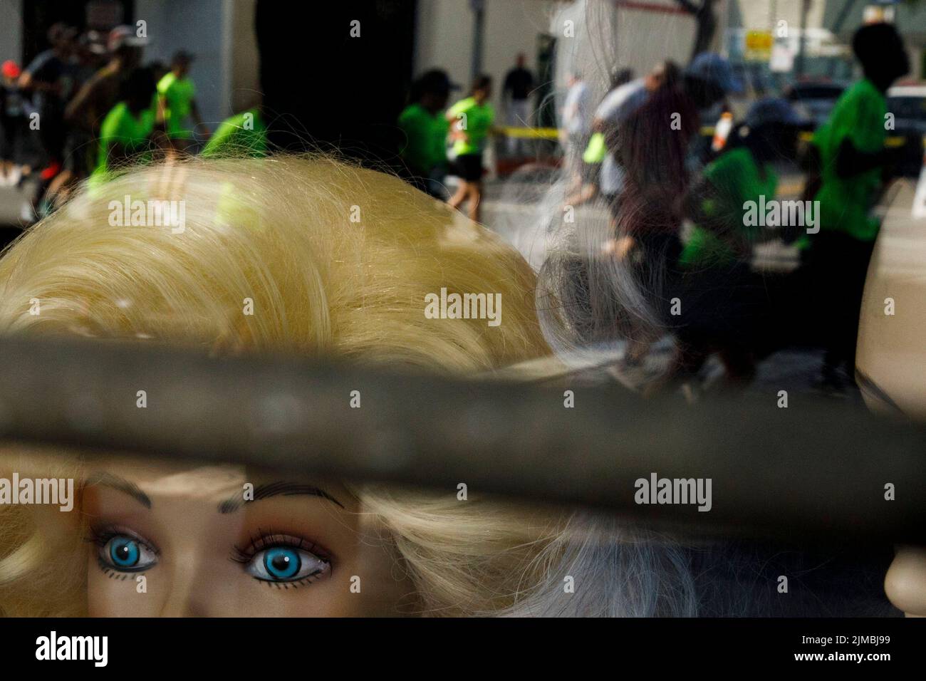 Los Angeles, CA, USA. 24th Mar, 2019. Runners are reflected in the ...