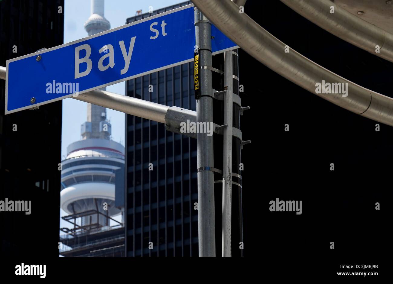 The Bay Street Financial District is shown next to the CN Tower in ...
