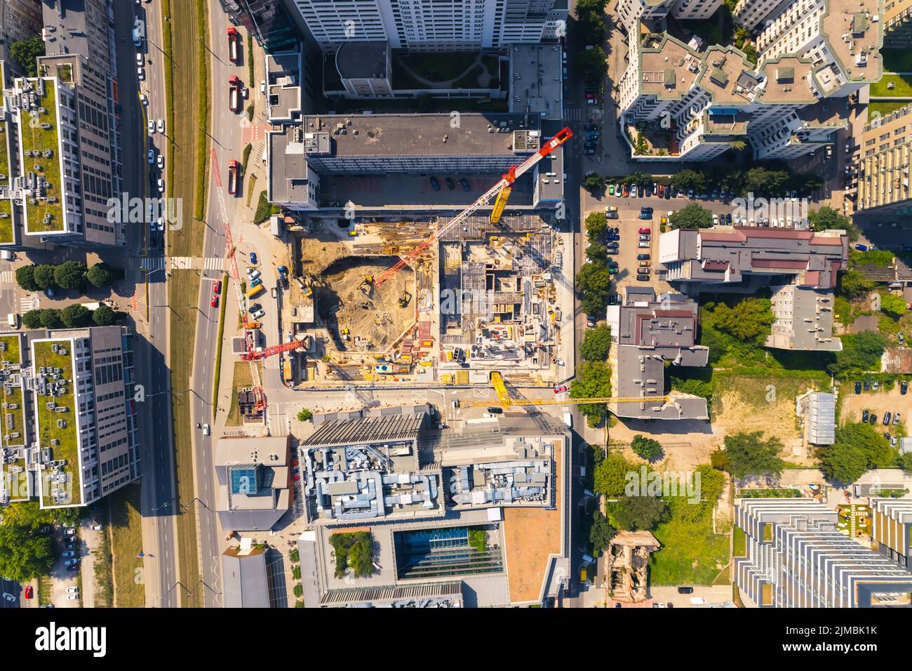 Construction site in the developed city. Engineers, crane operators ...