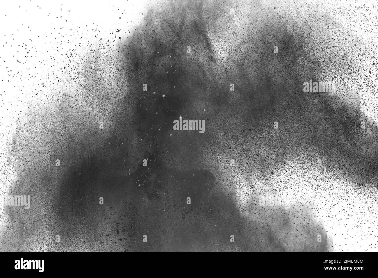 Black powder explosion against white background.Black dust particles ...