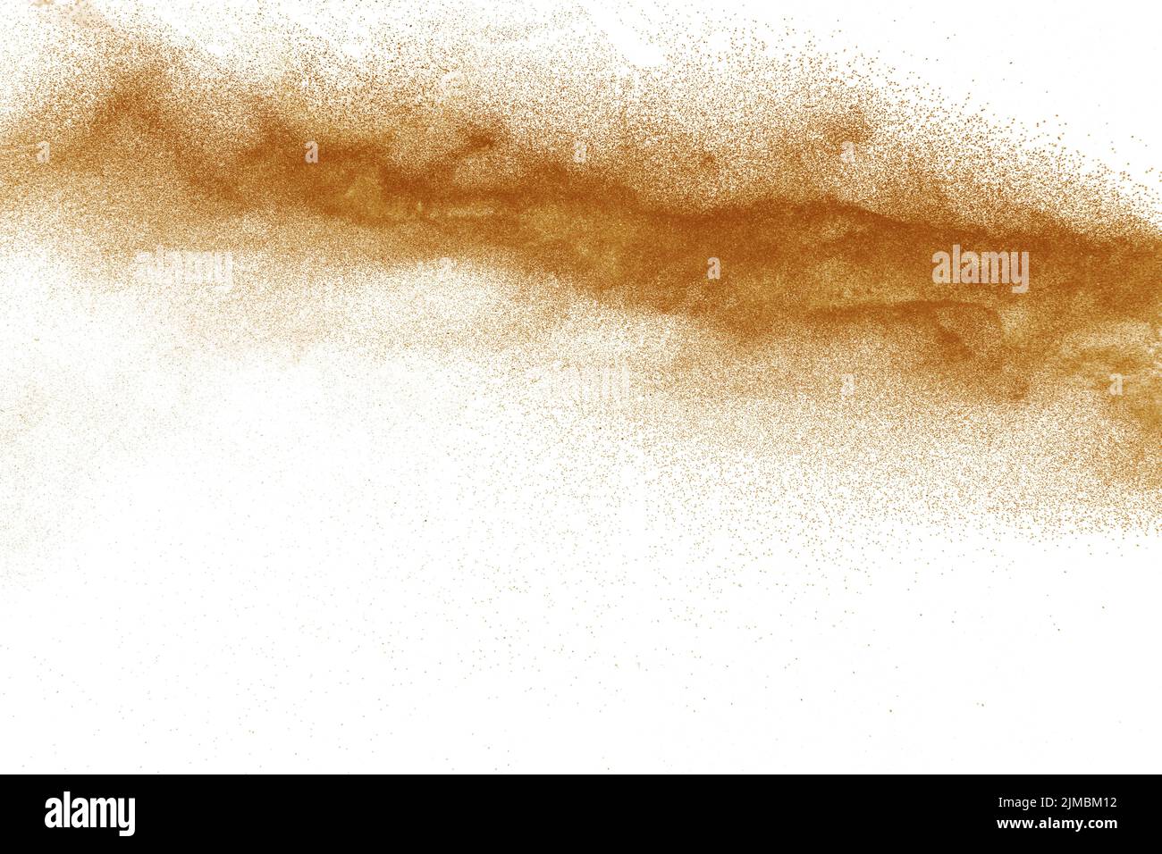 Golden sand explosion isolated on white background.Brown dust particles ...