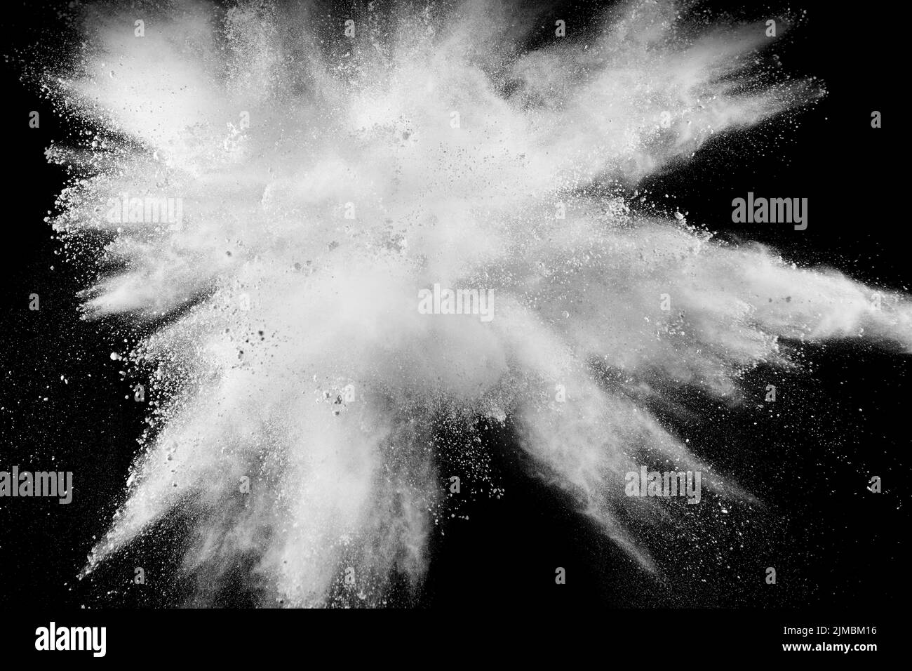 Bizarre forms of white powder explosion cloud against black background ...