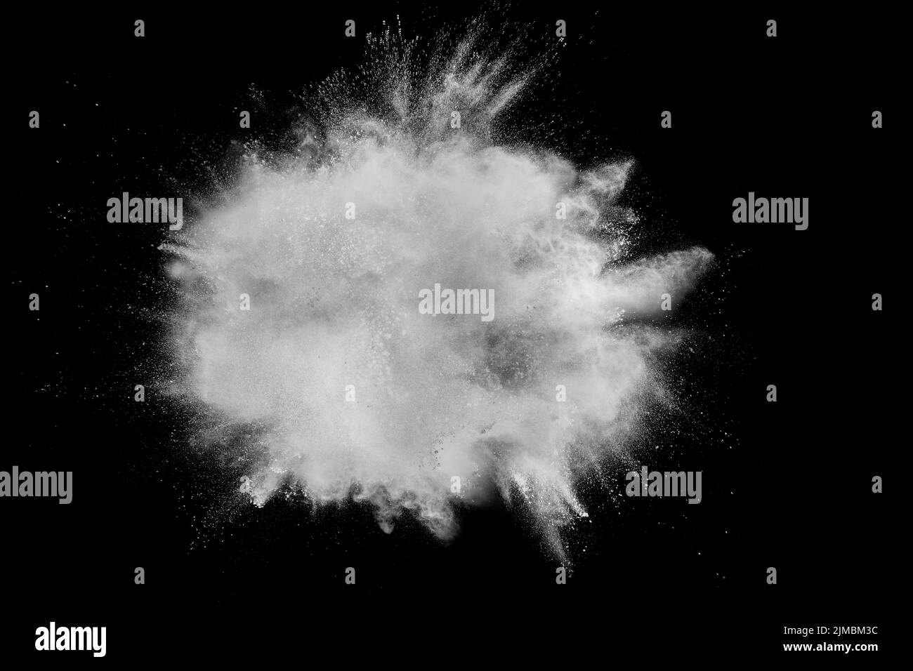 Bizarre forms of white powder explosion cloud against black background ...