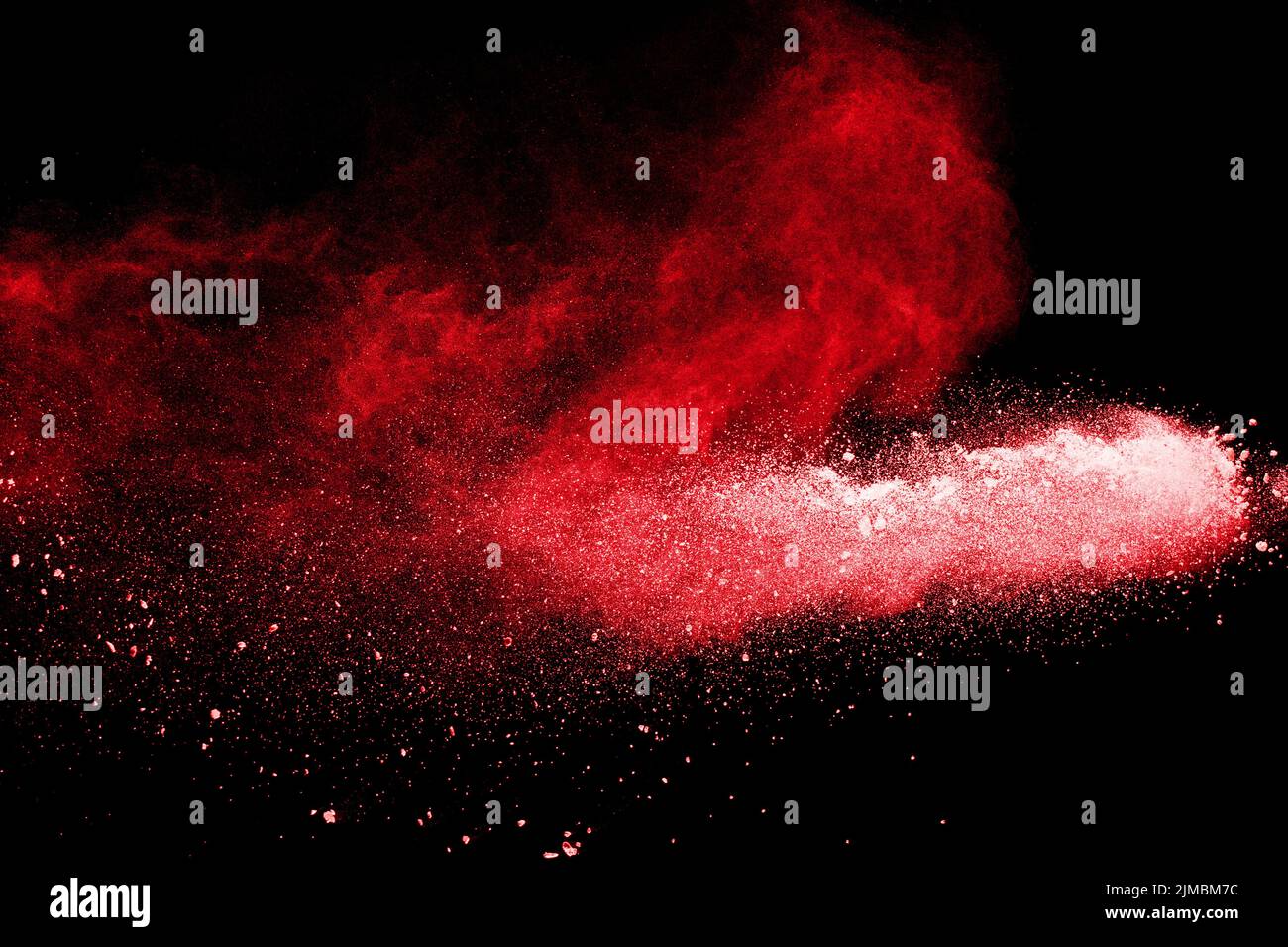 Red color powder explosion on black background.Freeze motion of red ...