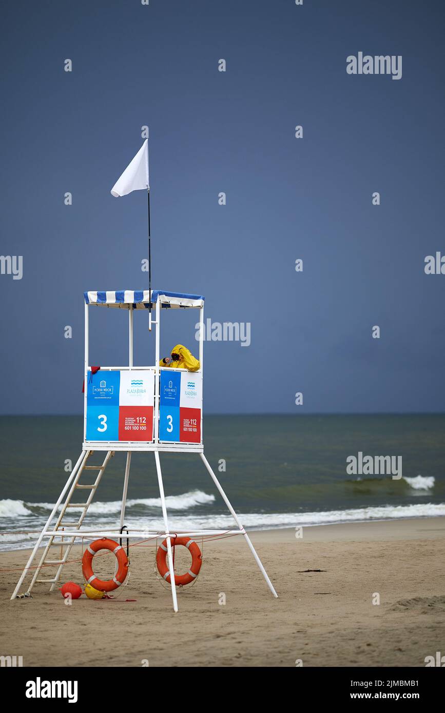 lifeguards hide in the lifeboat during a storm on the beach Stock Photo ...