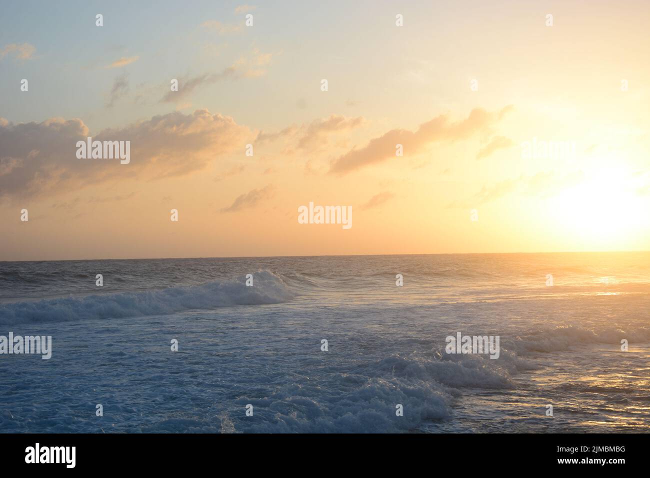 Dramatic sunrise over stormy sea Stock Photo - Alamy