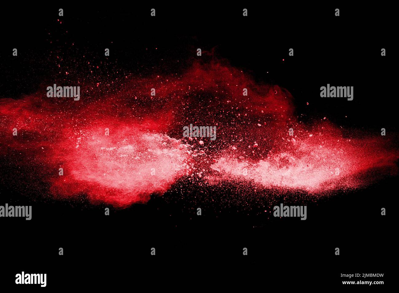 Red color powder explosion on black background.Freeze motion of red ...