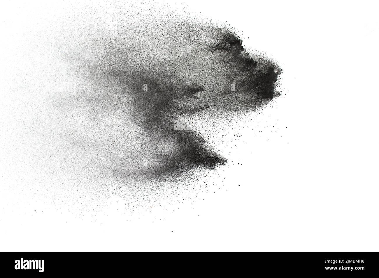 Black powder explosion on white background.Black dust particles splash ...
