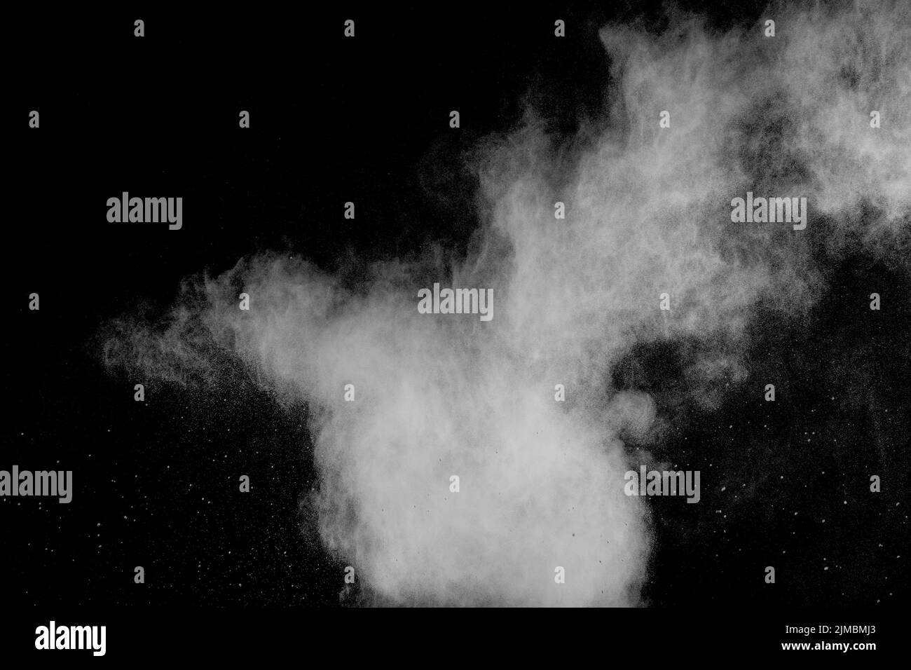 Freeze motion of white dust particles on black background. White powder ...