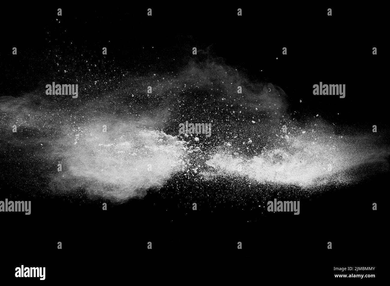 Bizarre forms of white powder explosion cloud against black background ...