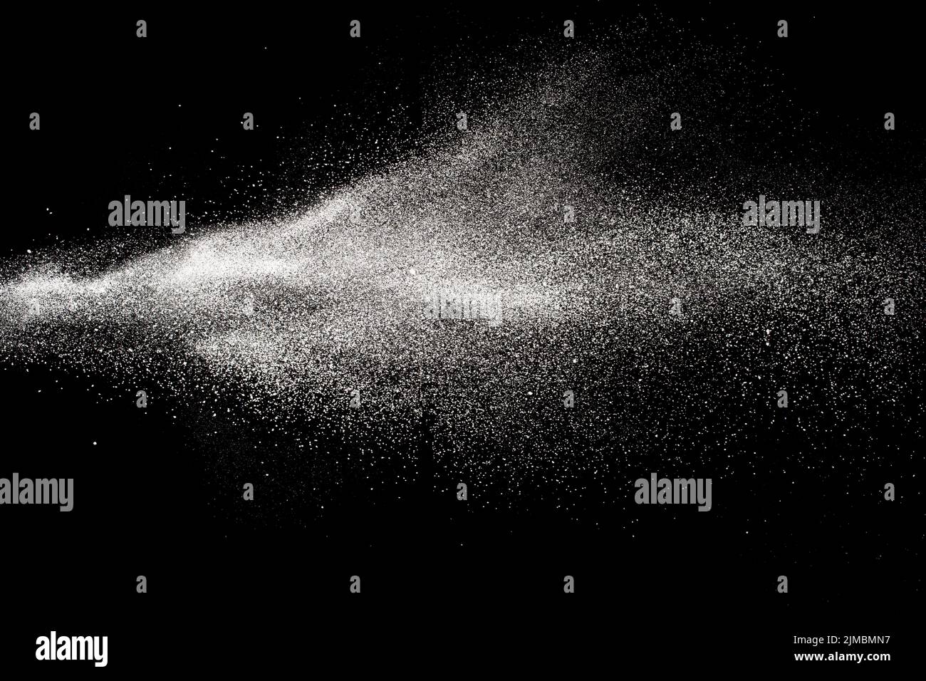 Bizarre forms of white powder explosion cloud against black background ...