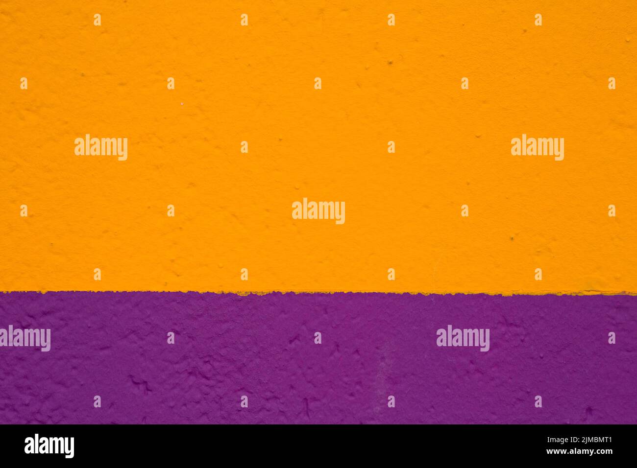 Texture painted wall in yellow and purple color Stock Photo - Alamy