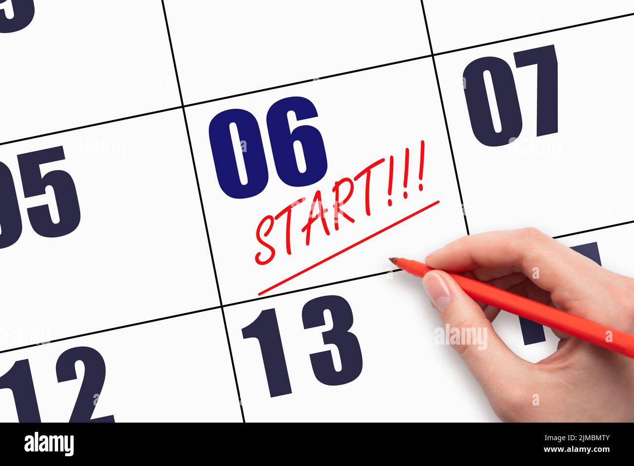 6th day of the month. Hand writing text START and drawing a line on ...