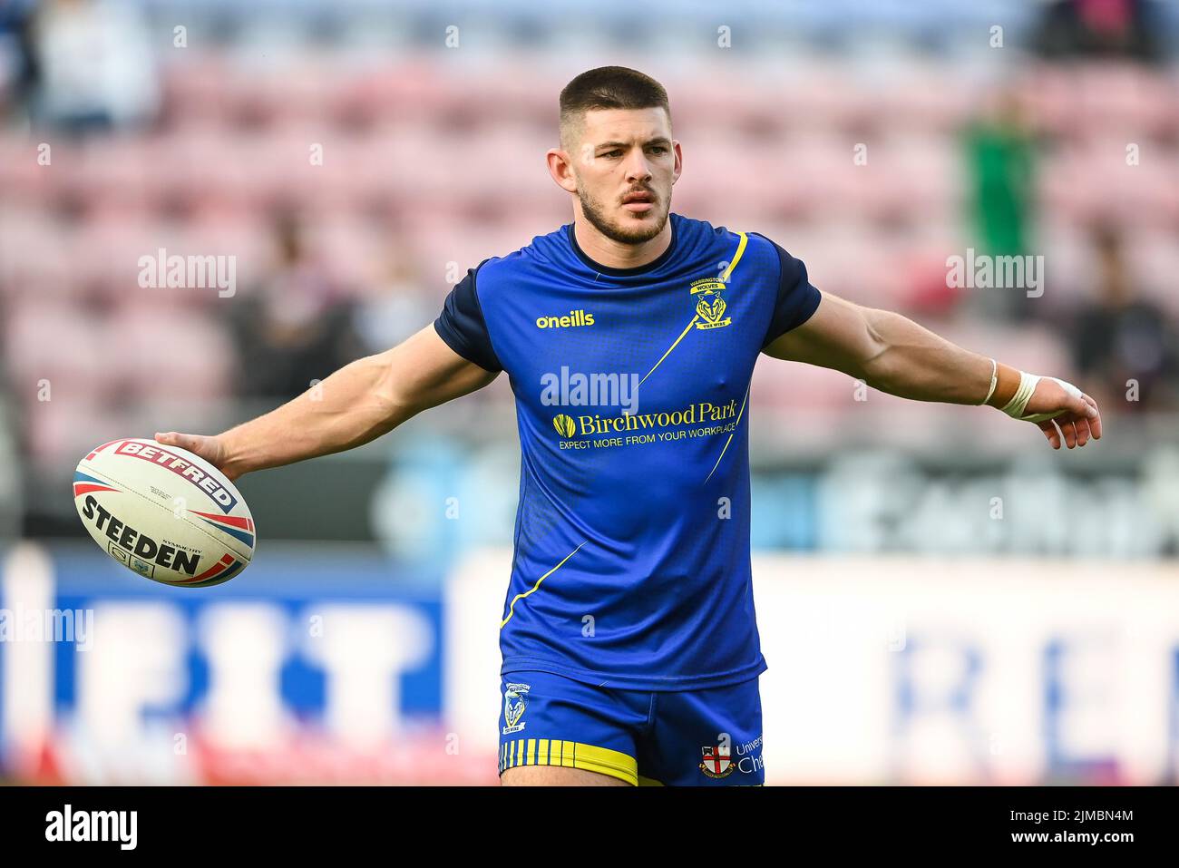 Danny Walker #16 of Warrington Wolves stretches during pre match warm ...