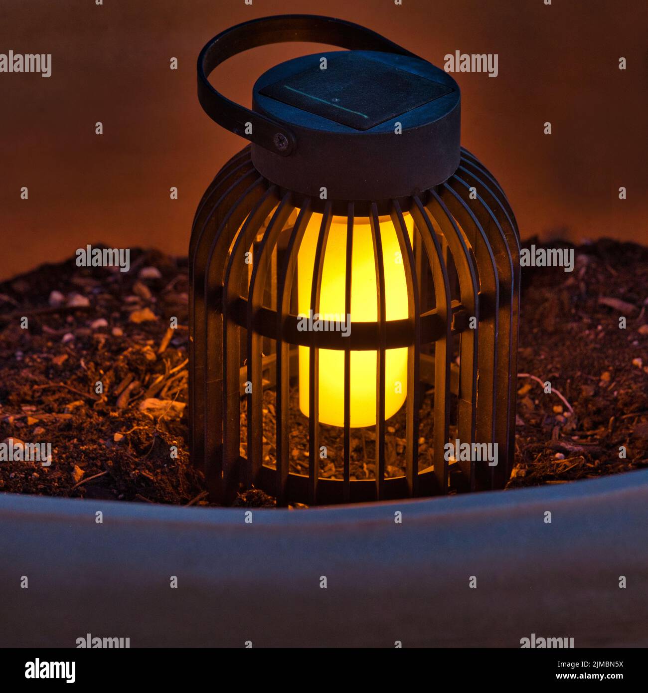 Solar Lantern. Isolated. A decorative solar lantern in a garden pot ...