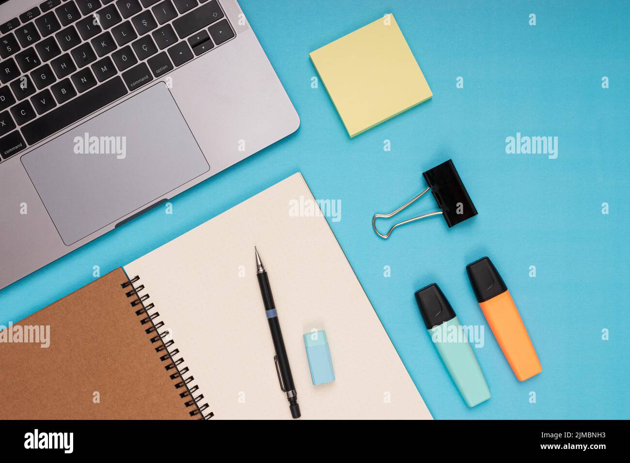 Laptop, notepad, pencil, eraser, colored pencils, clips and note paper ...