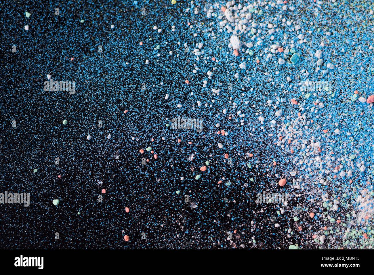 Colorful background of chalk powder. Multicolored dust particles ...