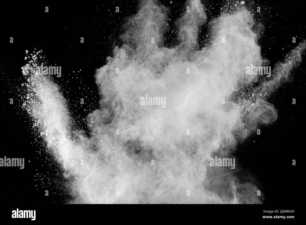 Bizarre forms of white powder explosion cloud against black background ...