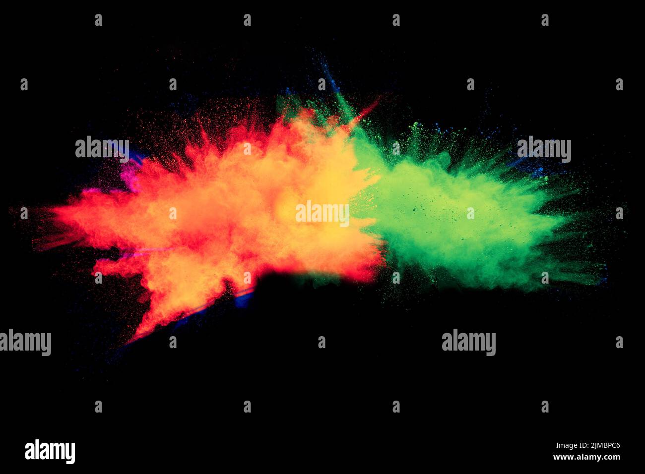 Abstract color powder explosion on black background.Freeze motion of ...