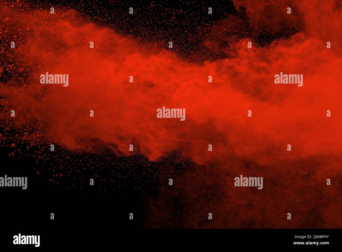 Red color powder explosion on black background.Freeze motion of red ...