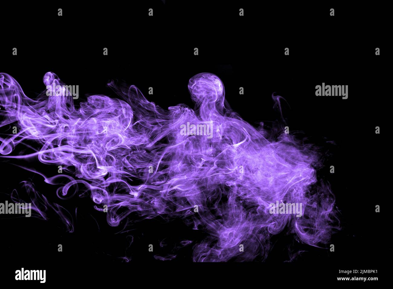 Abstract purple smoke flow in black background.Dramatic purple smoke ...