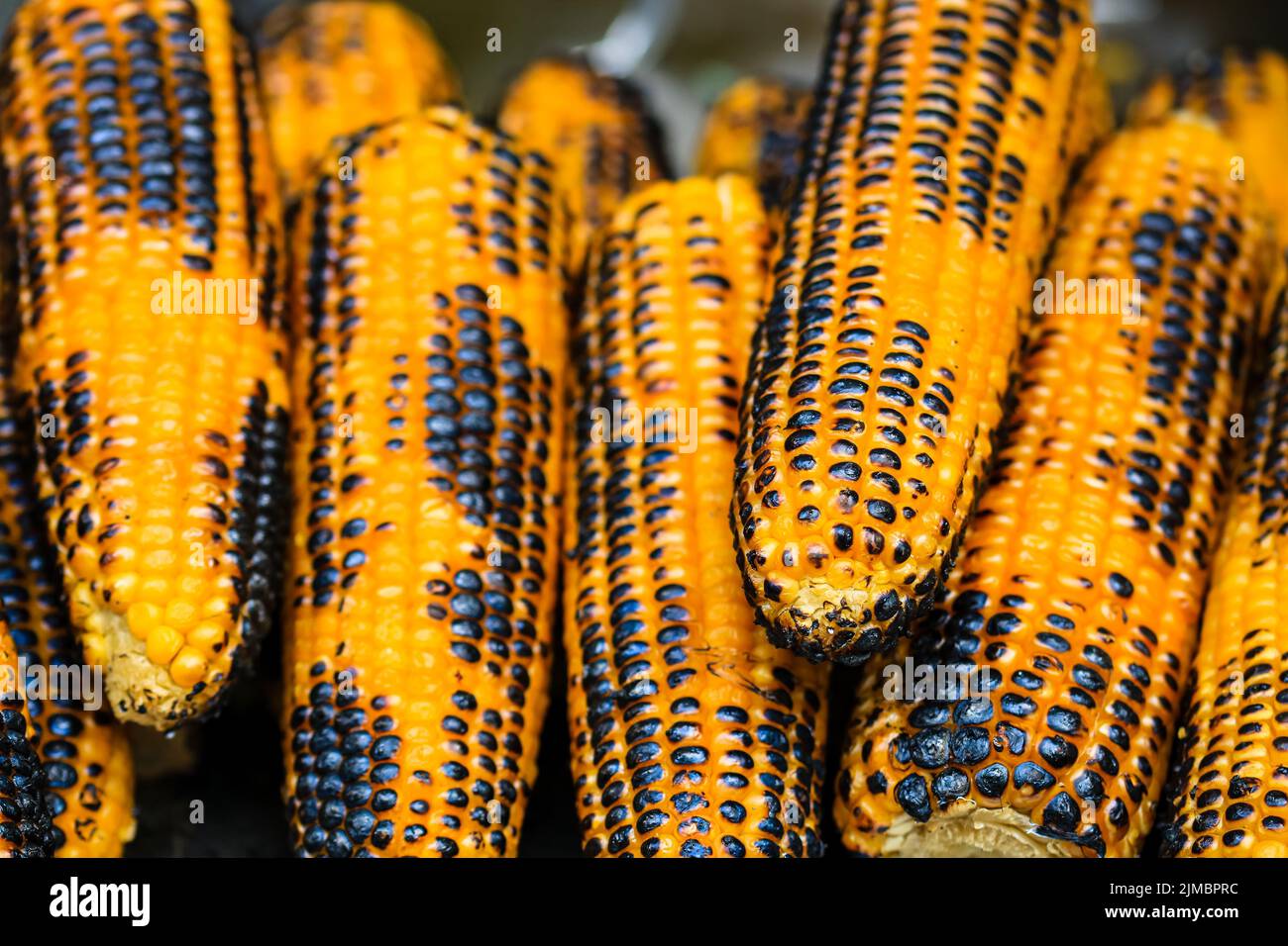 Grilled corn vegetable food background Stock Photo - Alamy