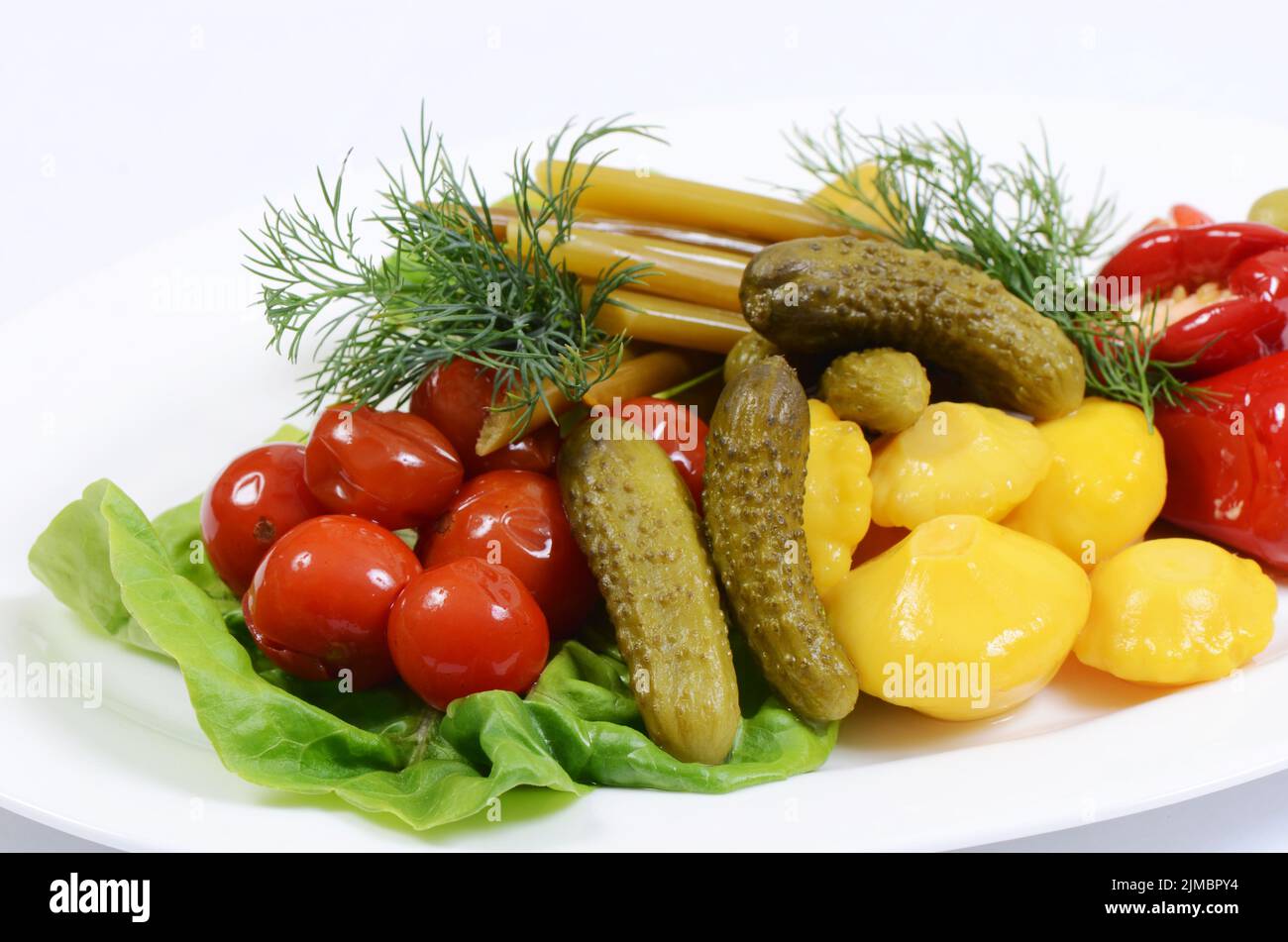 Different types of vegetables on white plate. Pickled cucumbers Stock ...