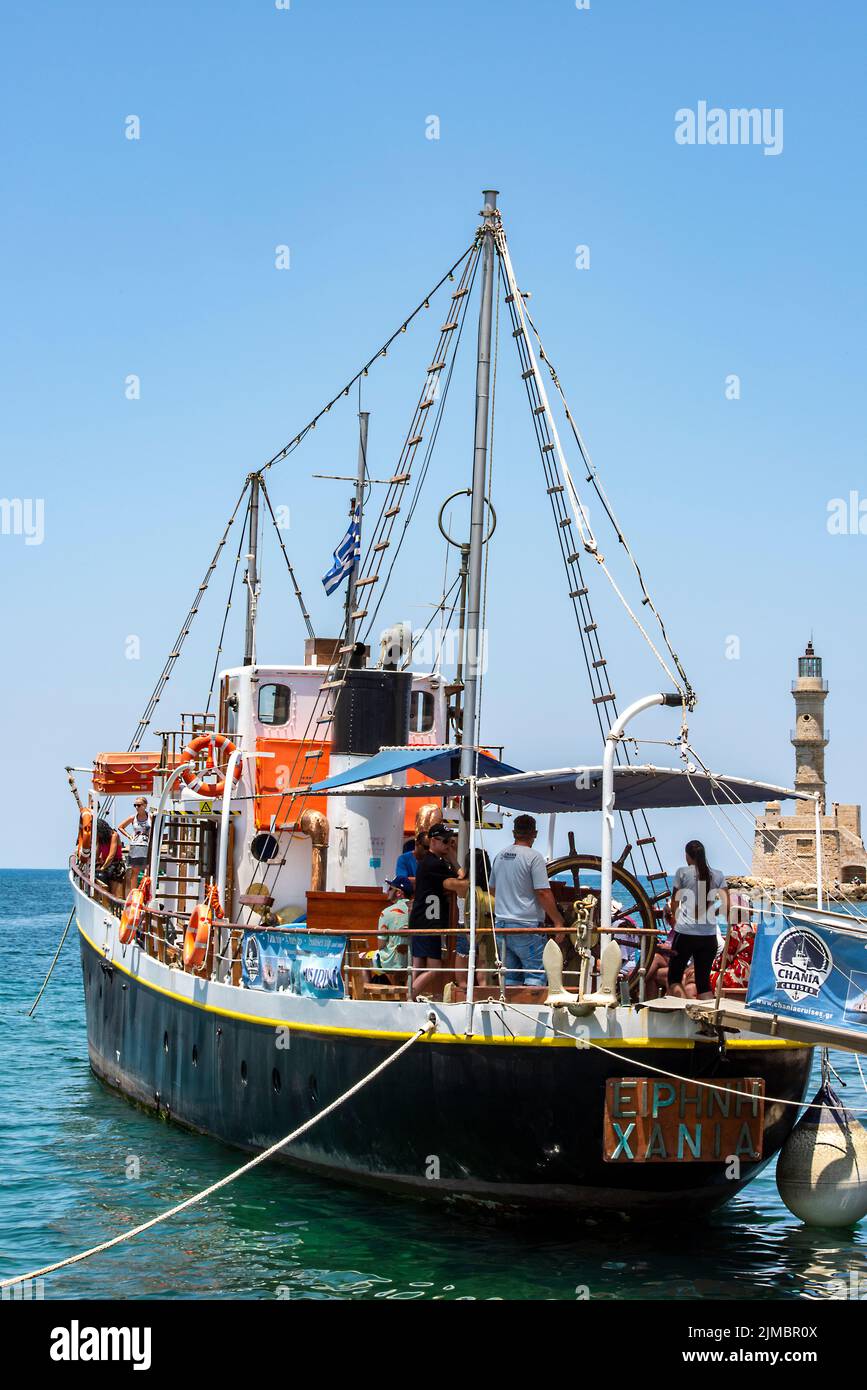 tourist vessel or day trip boat in the harbour on the greek island of ...