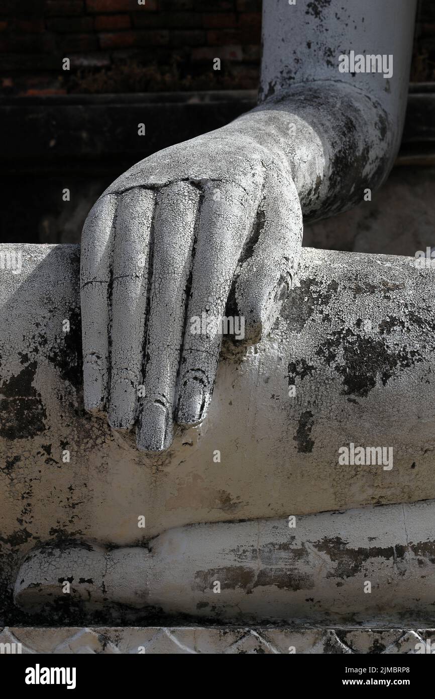 Buddha gray statue, sculpture hand on knee with shallow focus Stock ...