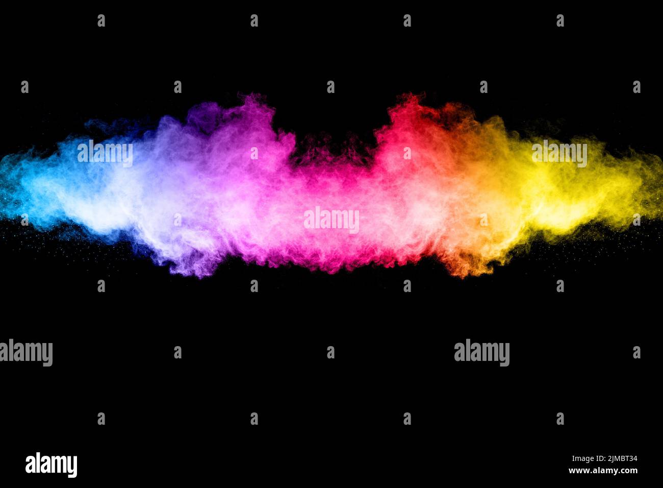 Abstract colorful powder explosion on black background.Freeze motion of ...