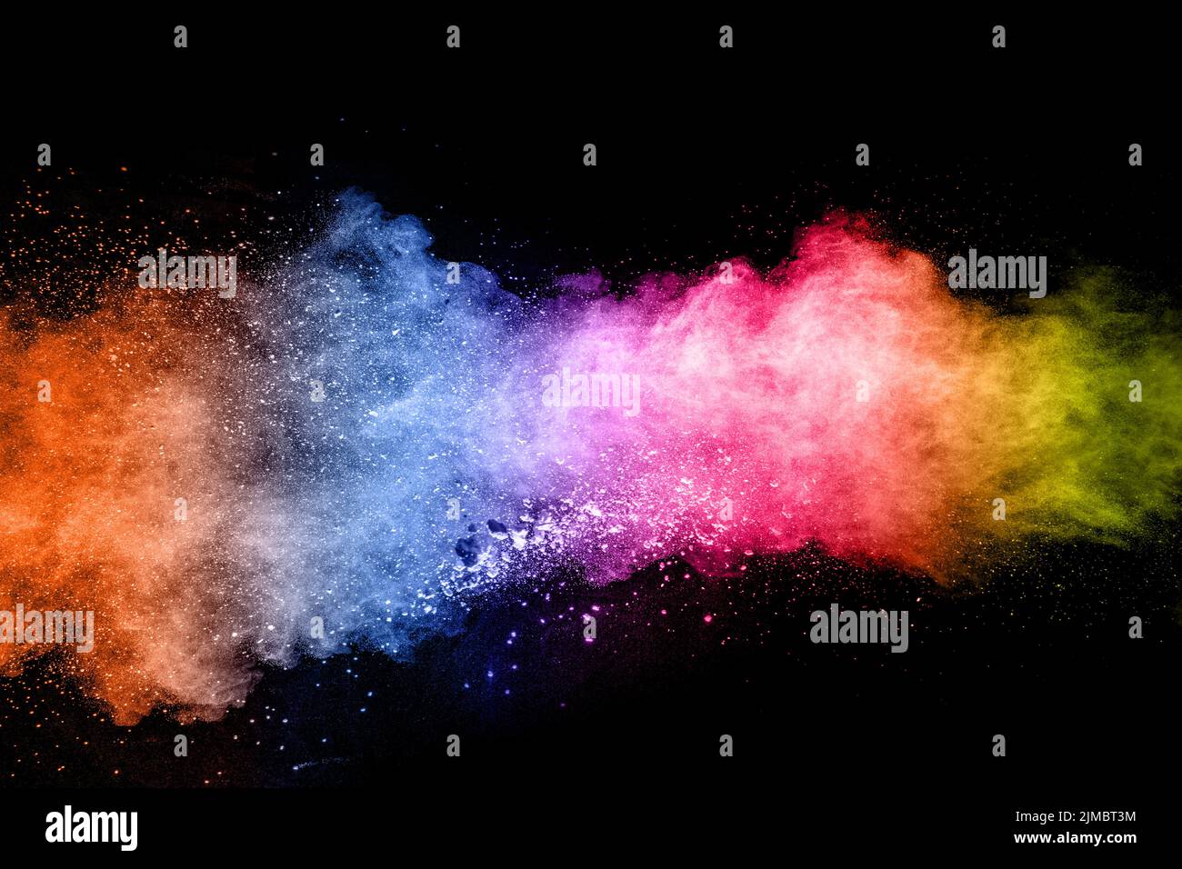 Abstract multi color powder explosion on black background. Freeze ...