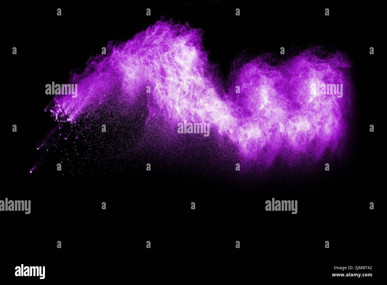 Purple color powder explosion on black background Stock Photo - Alamy