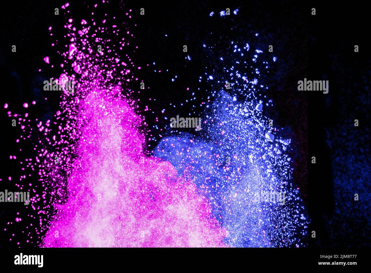 Launched colorful powder on black background.Color powder explosion ...