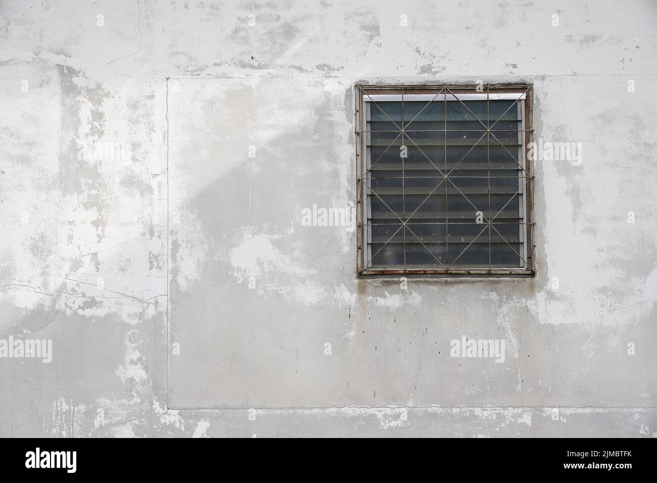 dusty white ancient building facade with glass louver windows Stock ...