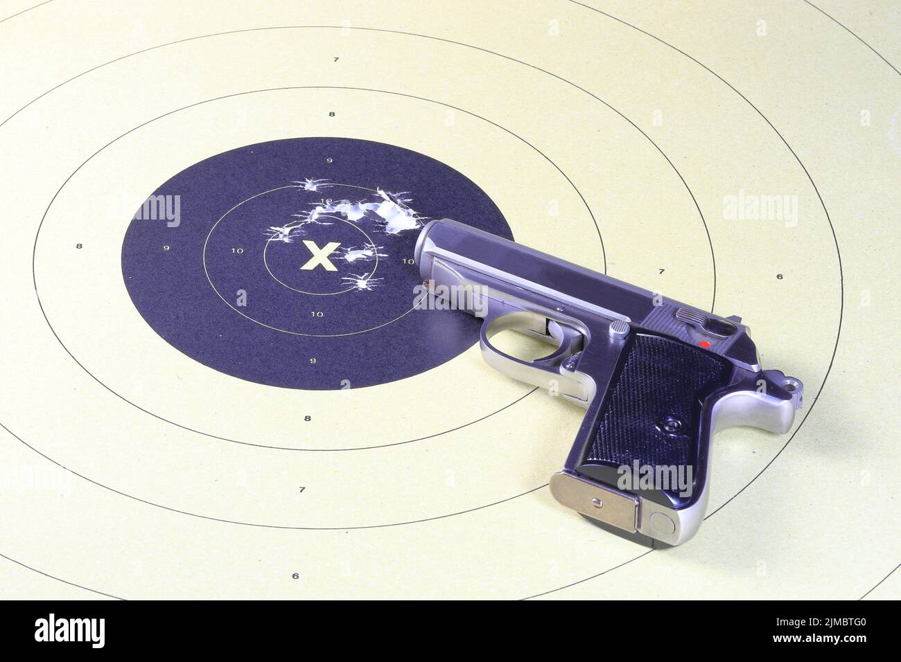 Gun and shooting target With Bullet Holes. Classic Paper Shooting ...