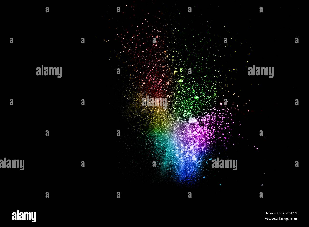 Launched colorful powder on black background.Color powder explosion ...