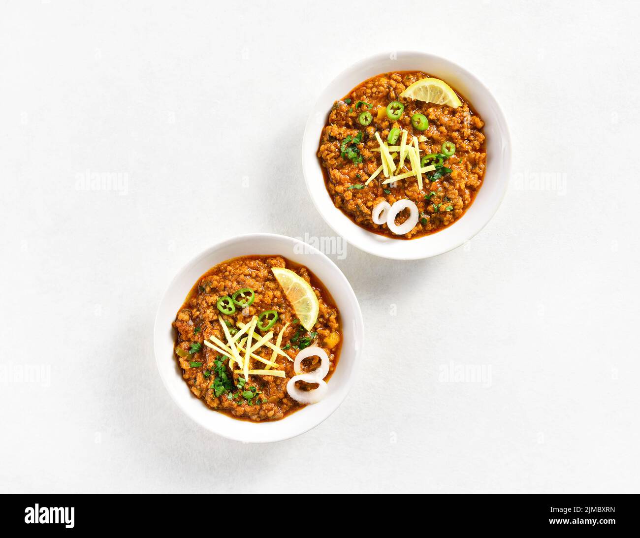 Keema curry in bowls over white background with free text space. Indian ...