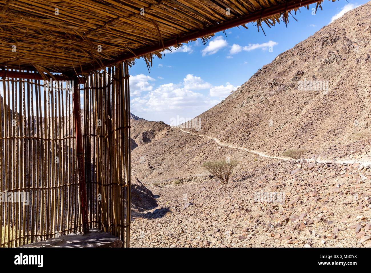 Mountain shelter made of cane and palm tree branches and leafs with ...