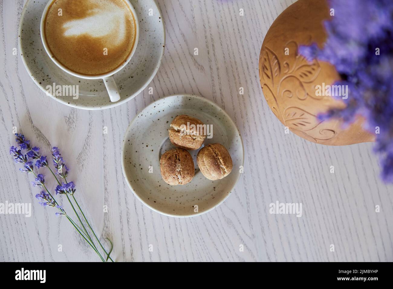 Vegan natural nuts sweets with no sugar. Cup of cappuccino on wooden ...