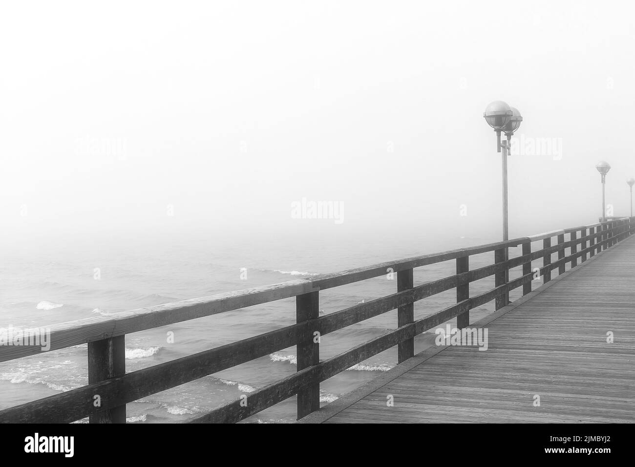 Pier in Costal Fog Stock Photo - Alamy