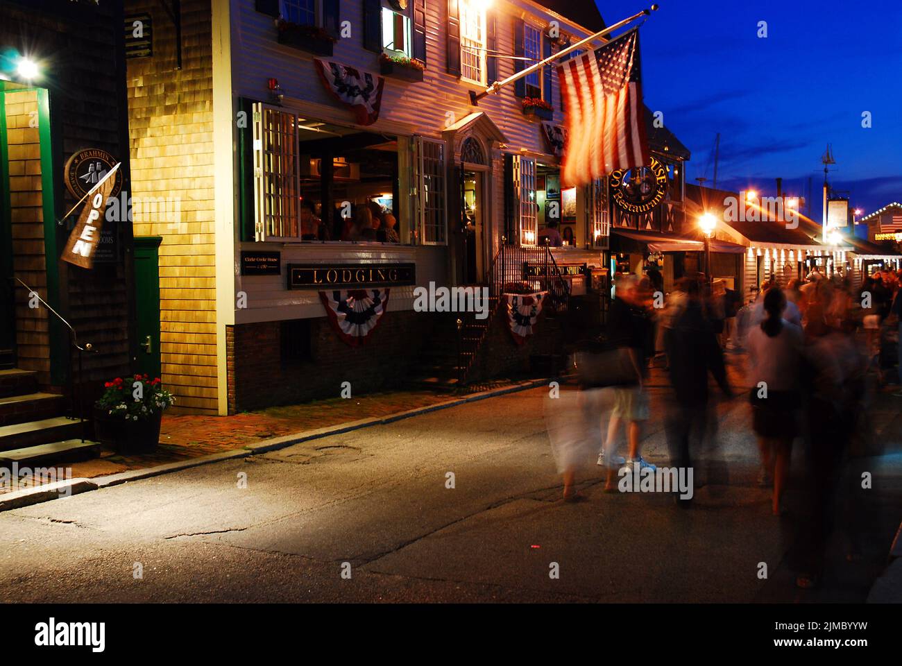 At night, visitors crowd the area in Bowens Wharf in Newport Rhode ...