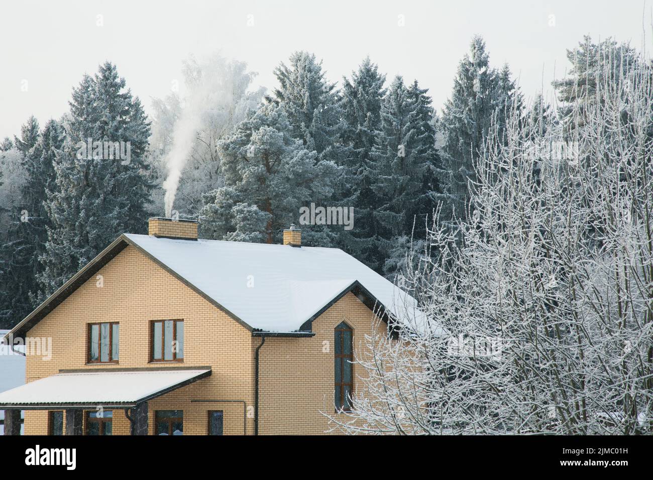 Brick house on a frosty winter day among the trees Stock Photo - Alamy
