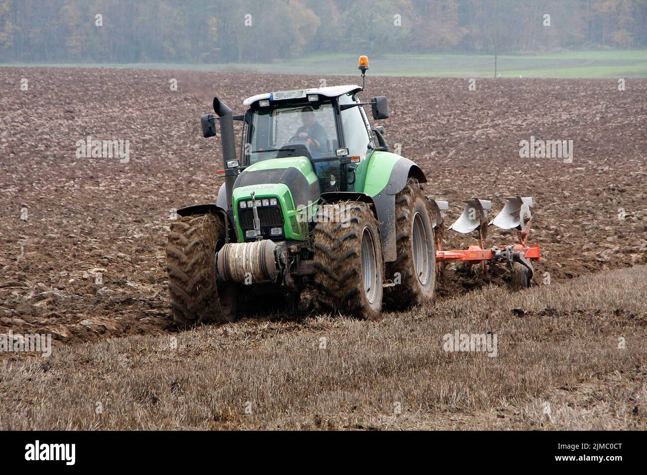 Plowing of an agricultural field Stock Photo - Alamy