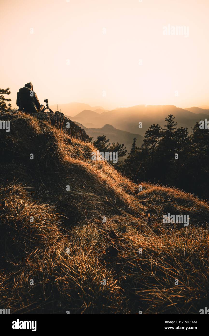 Man silhouette stay on sharp rock peak. Satisfy hiker enjoy view. Tall ...